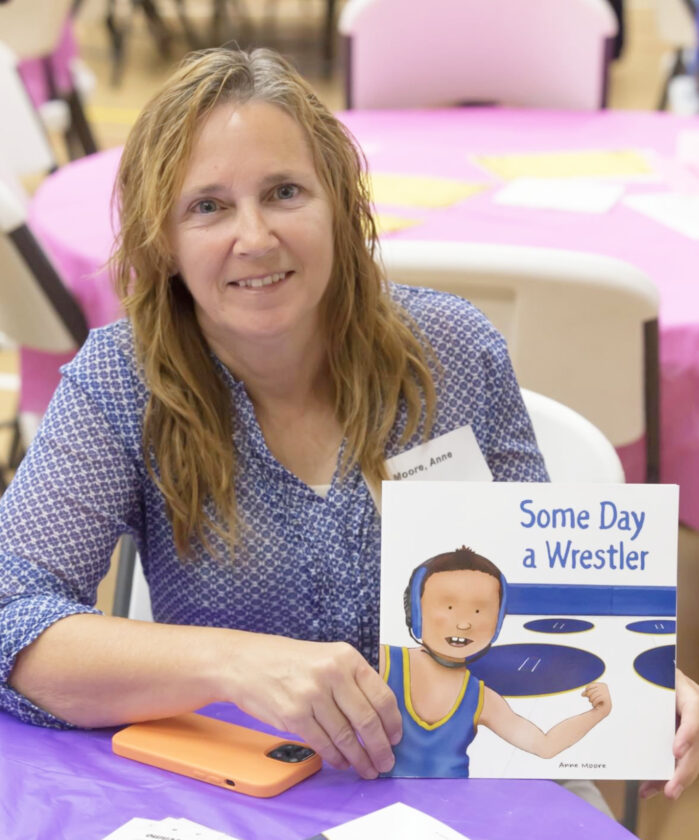 Passing on a legacy: Local author fosters love for wrestling in ...